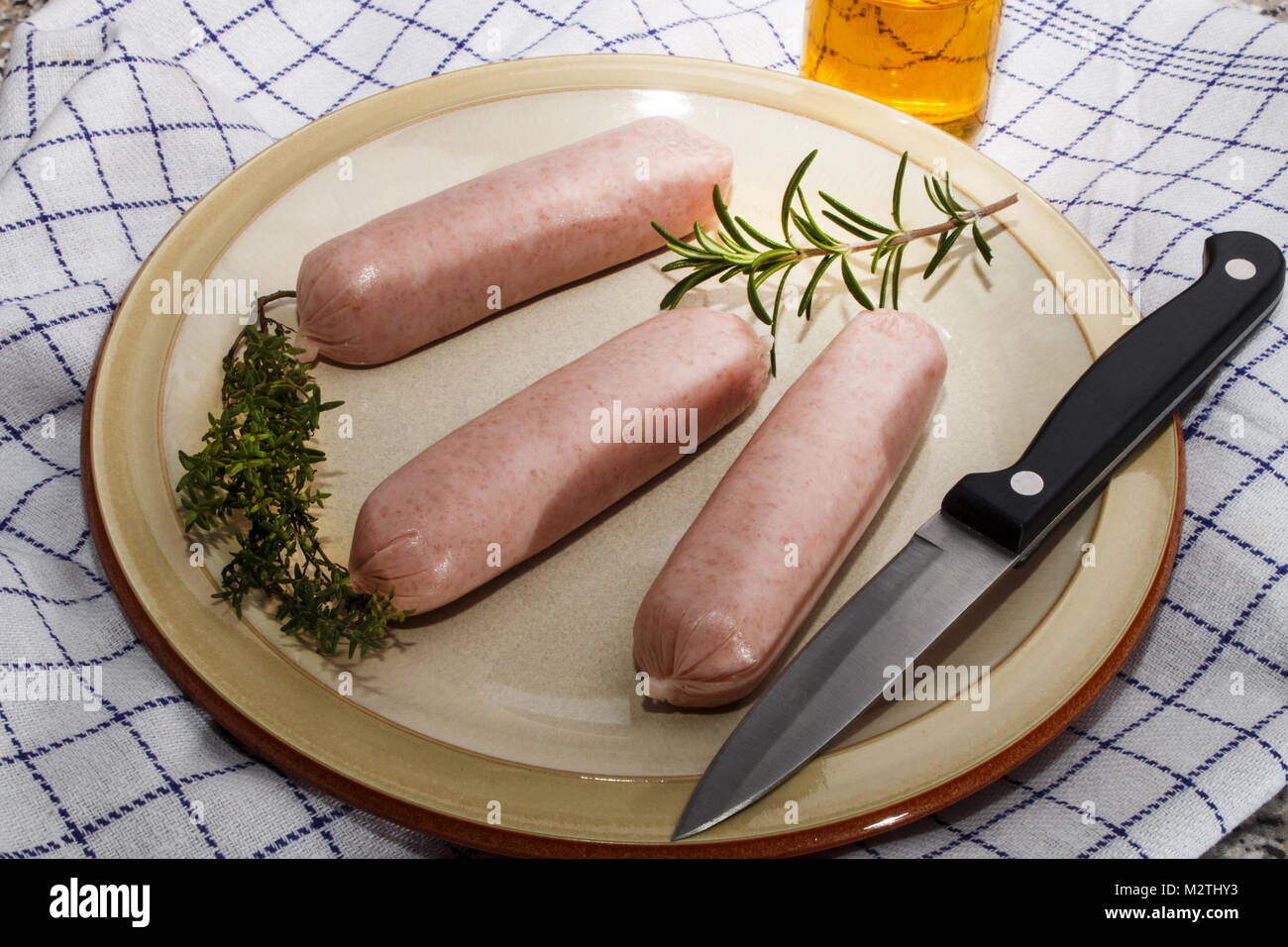 home made raw british sausages with herbs on a plate Stock Photo - Alamy