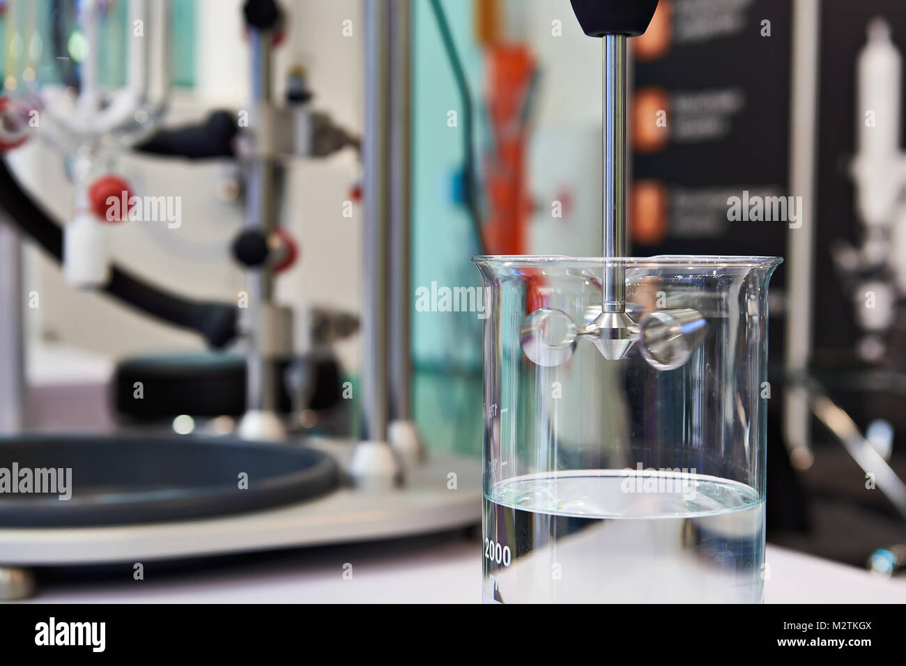 Flask and a mixer in a chemical laboratory Stock Photo - Alamy