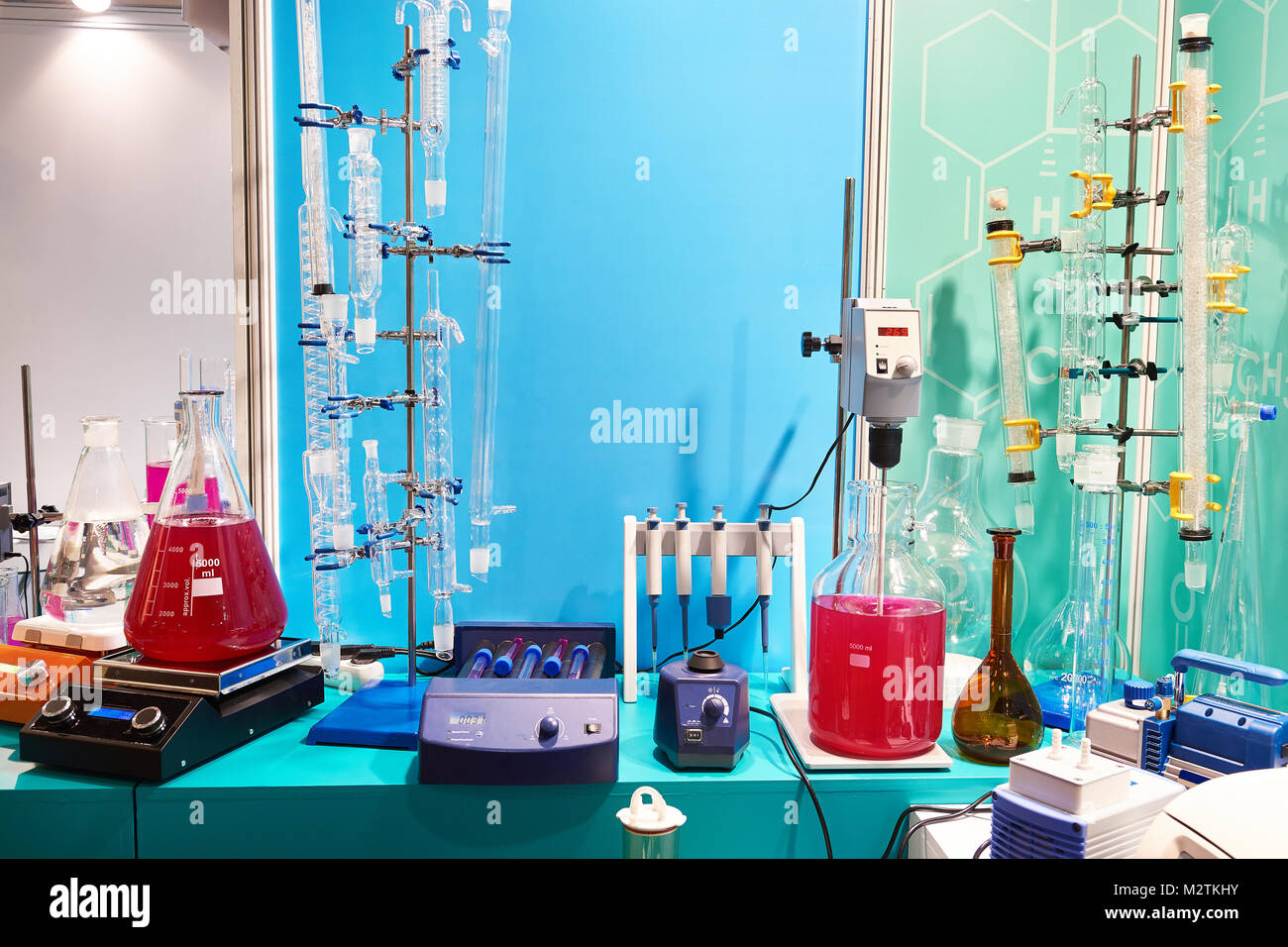Flasks, burettes and shakers in the chemical laboratory with samples ...