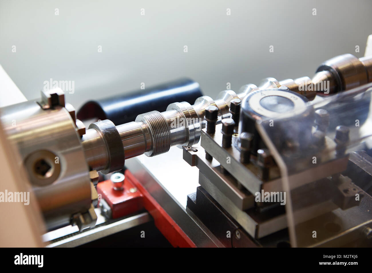 Lathe with cutters and workpiece closeup Stock Photo - Alamy