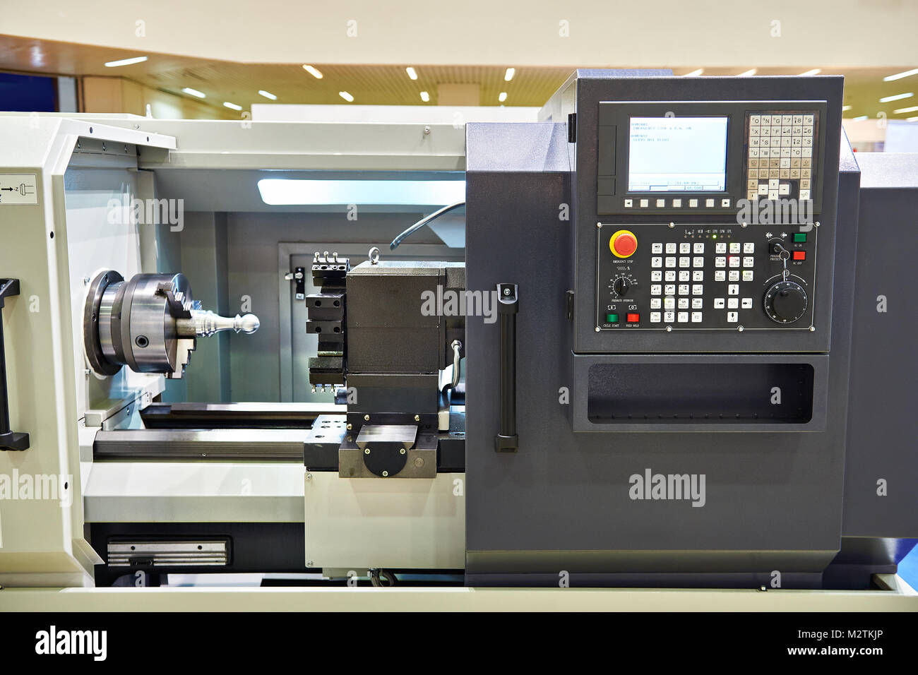 CNC lathe with cutters and workpiece Stock Photo - Alamy