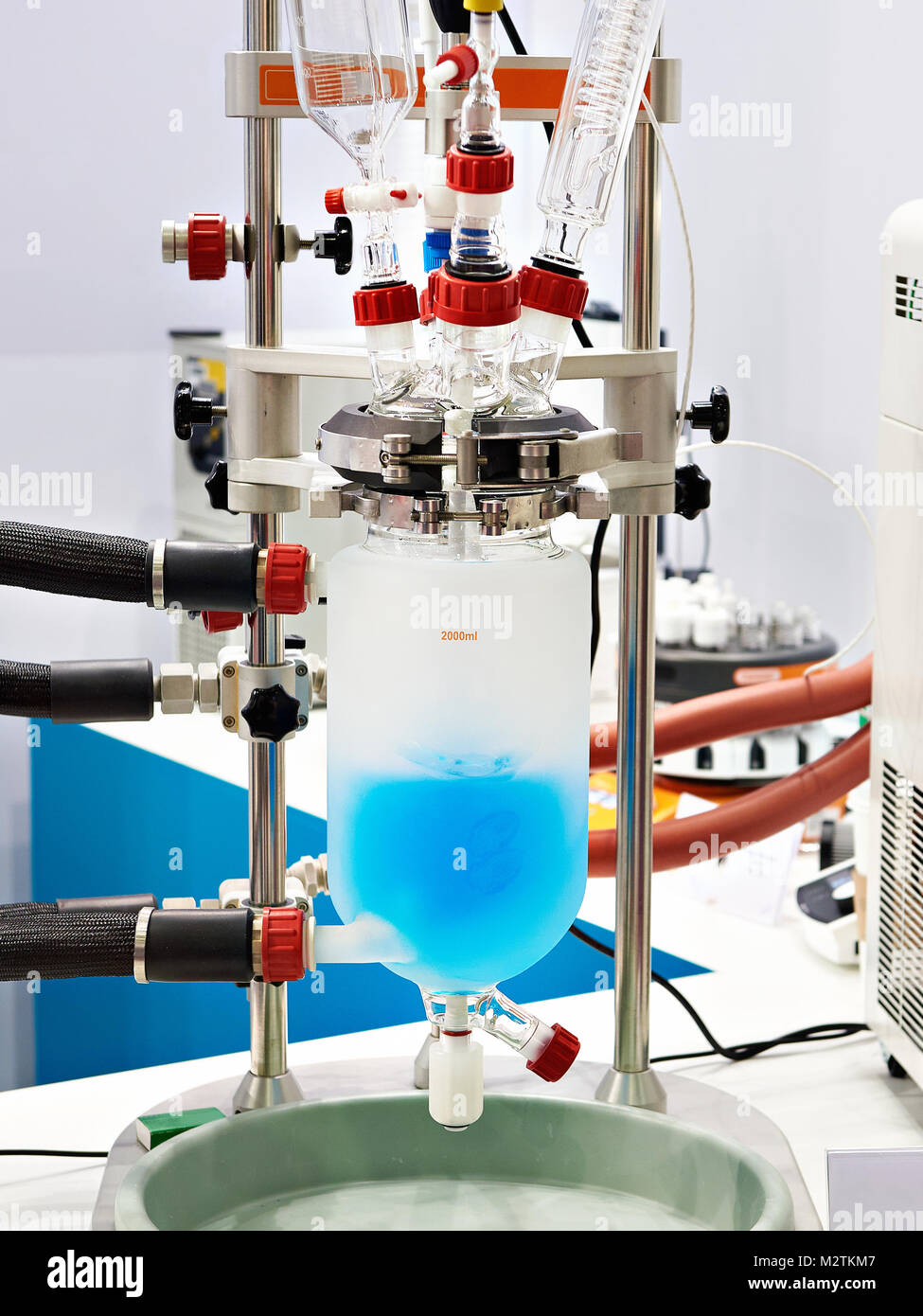 Laboratory reactor with blue liquid Stock Photo - Alamy