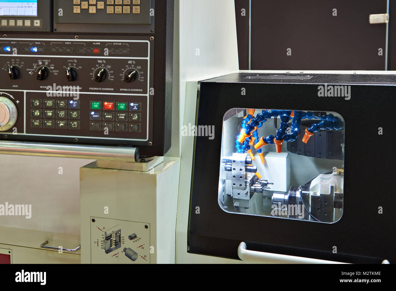 CNC lathe with cutters and workpiece Stock Photo - Alamy