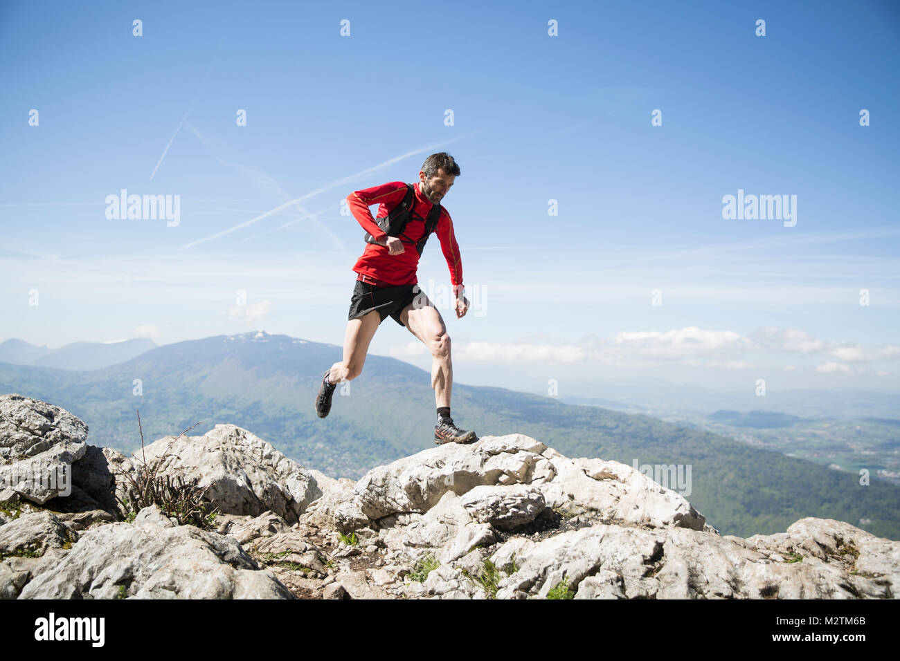 Adult running on rocks hi-res stock photography and images - Alamy