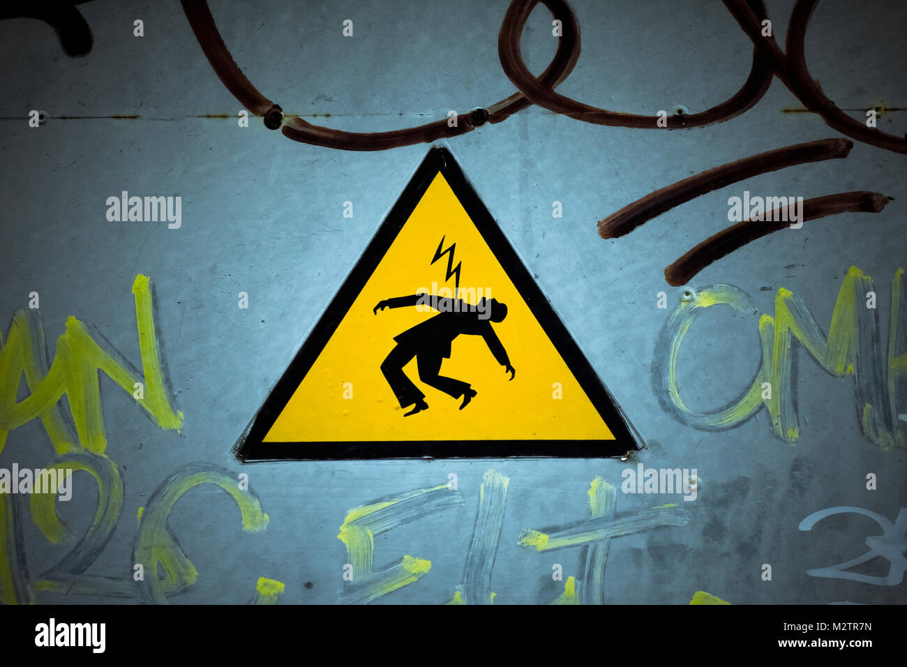 Yellow hazard warning triangle , sign of danger of death by electric ...