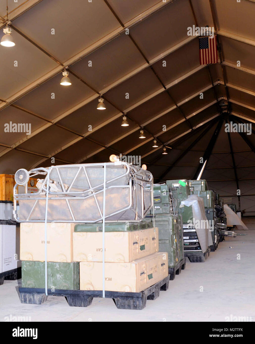 Pallets of equipment ready to ship out of Iraq sits in a hanger at the ...
