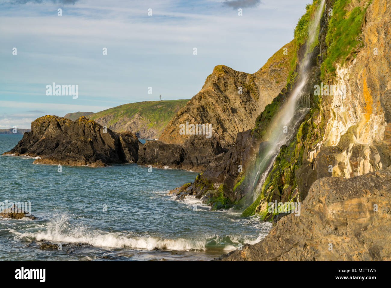 Waterfall of the River Saith cascading into the sea in Tresaith ...