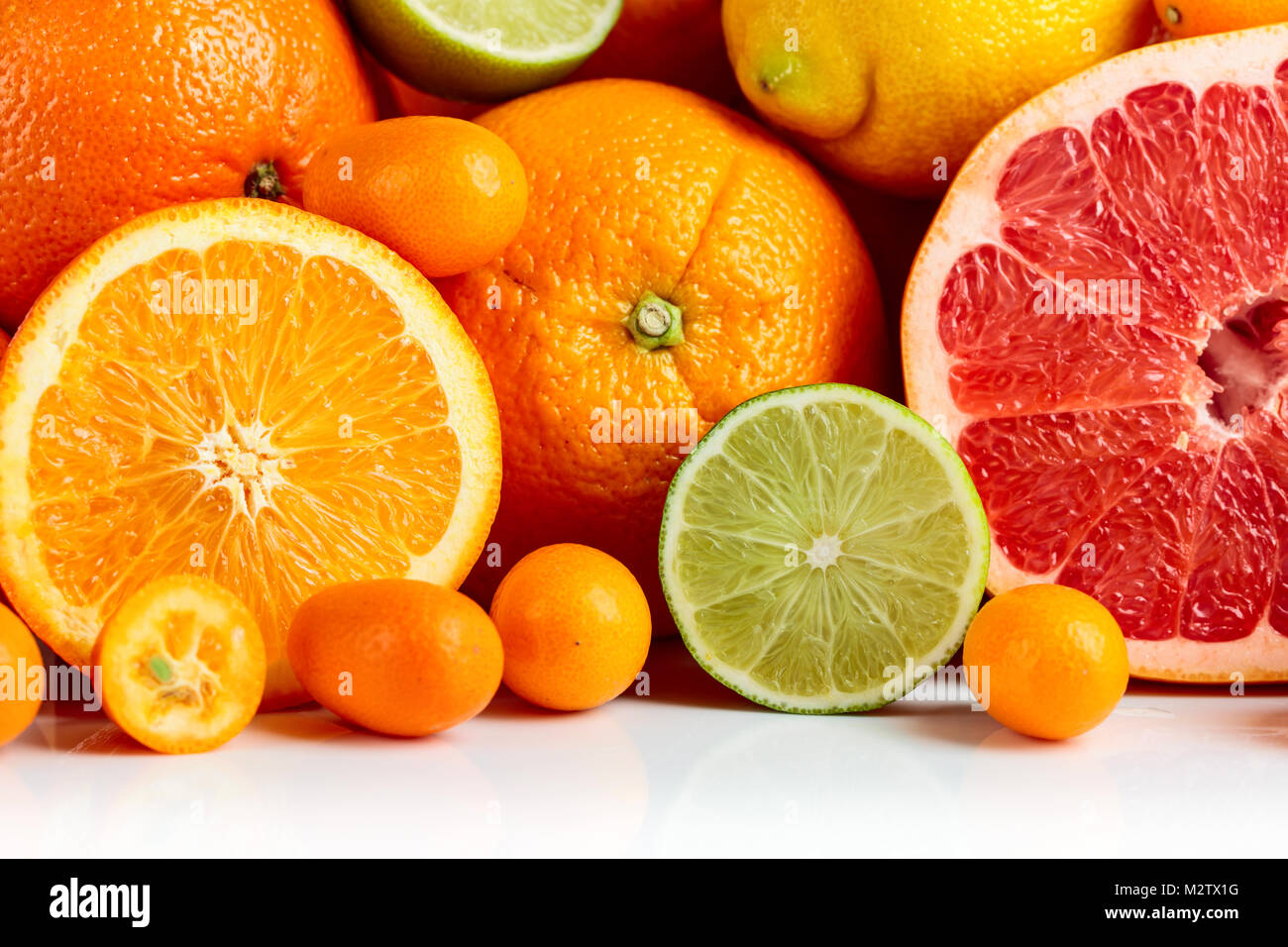 Close up of citrus fruits. Pieces of lemon, lime , tangerine , pink ...
