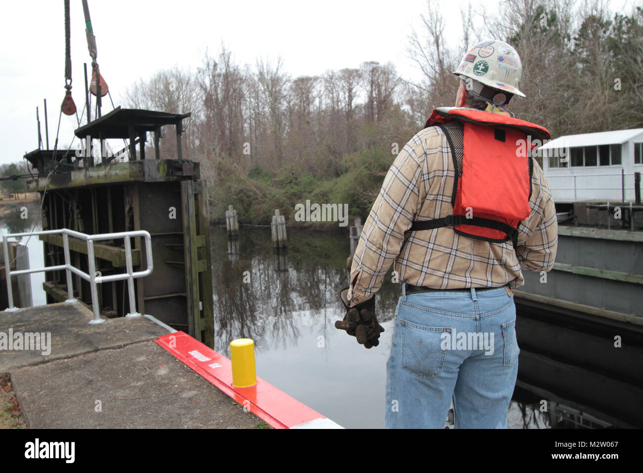 Crews work to remove lock gates at the Dismal Swamp Canal’s South Mills ...