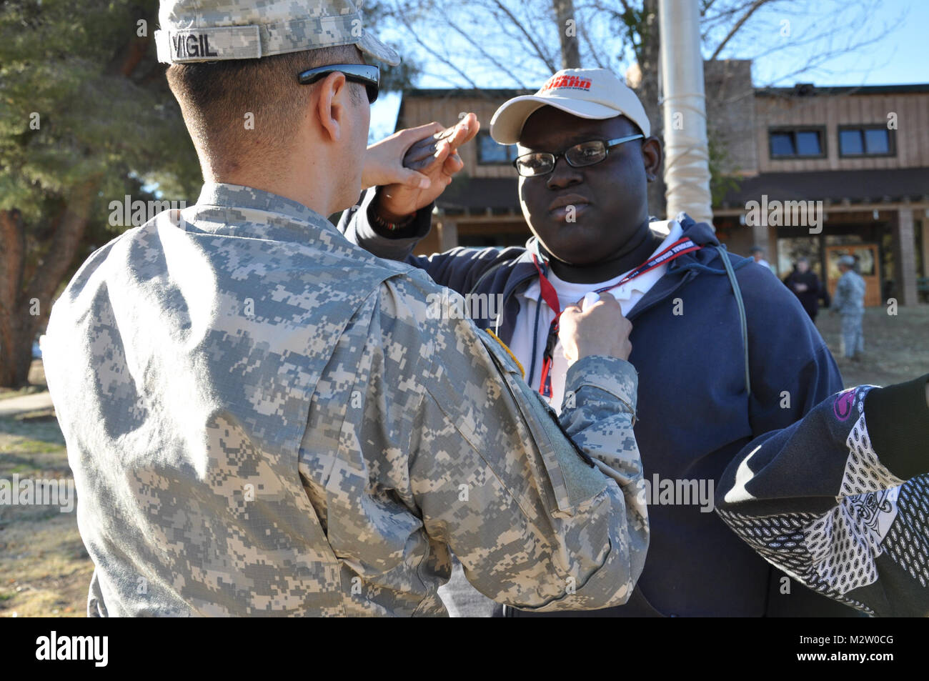 A youth participant receives instruction from Staff Sgt. Michael Vigil ...