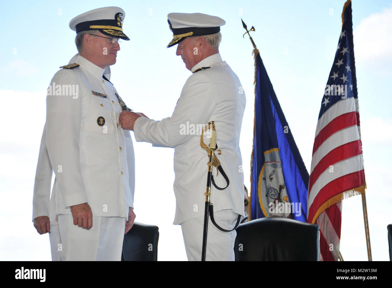 U.S. Pacific Command, pins the Distinguished Service Medal on Adm ...