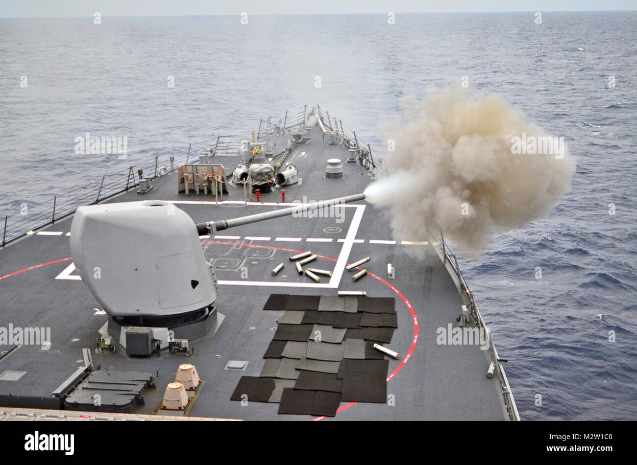 USS McCain fires its 5-inch, .54-caliber gun during a high-speed ...