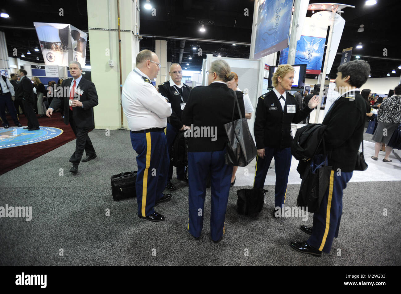 Conference attendees visit the Exhibit Hall the 2012 Military Health ...