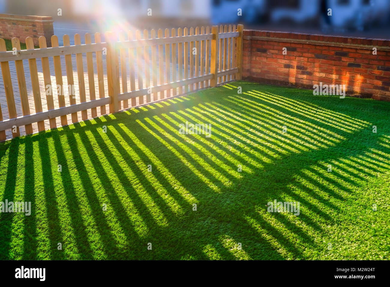 Brick house picket fence hi-res stock photography and images - Alamy