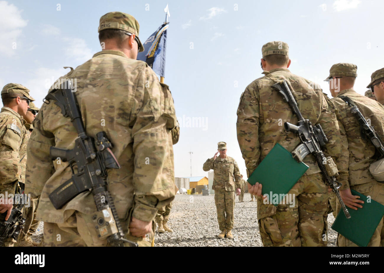 Brigade Commander Col. Todd Wood salutes his soldiers from Company D ...