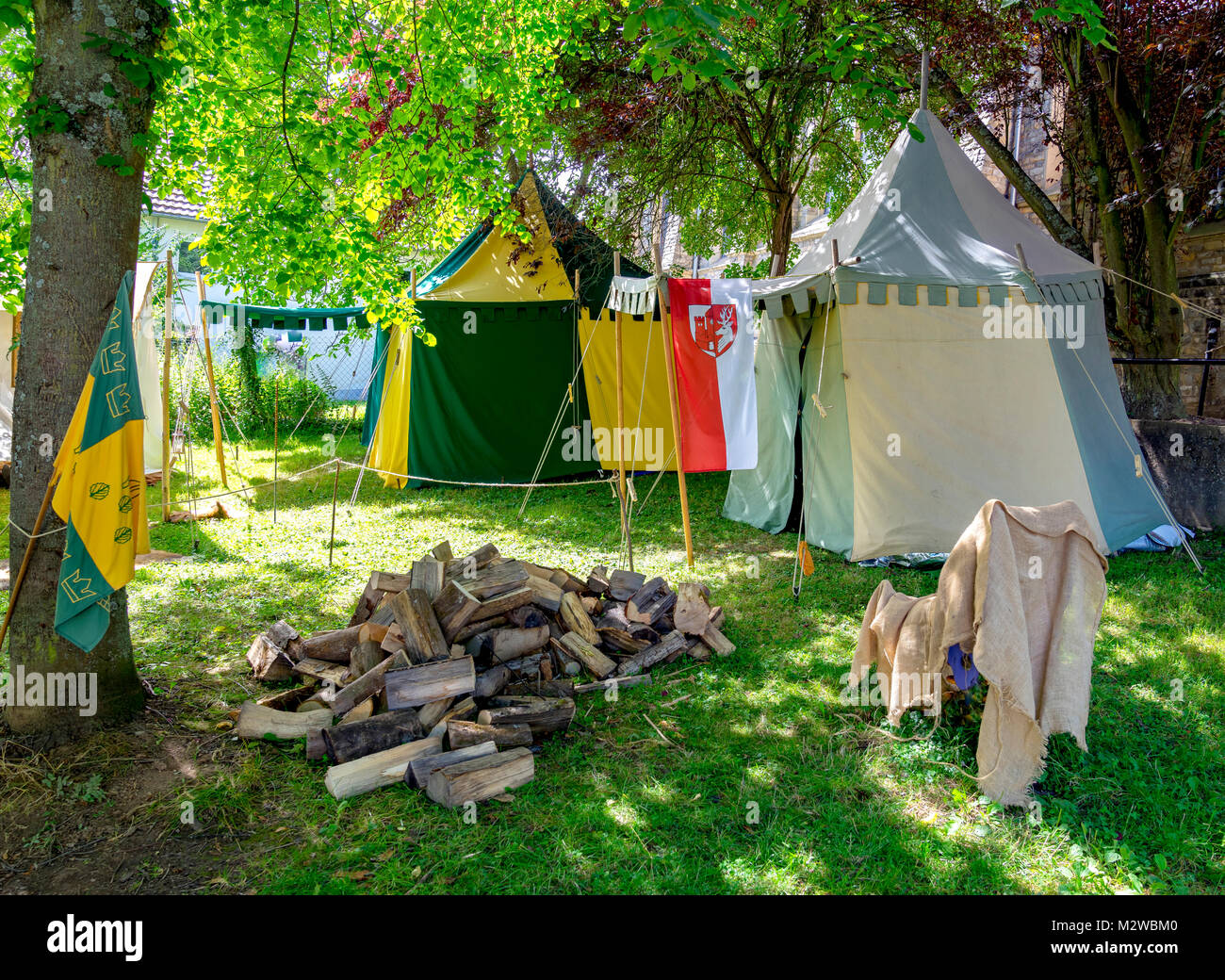 Colourful tents stand together in a group Stock Photo - Alamy