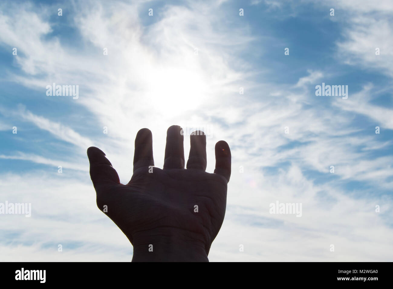 Human hand pointing to the sky, concept - faith, hope, seeking help ...