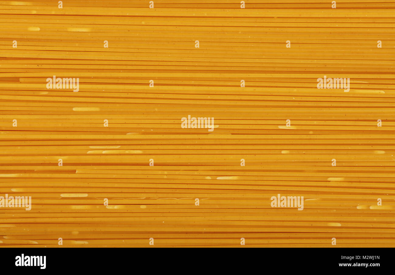 Close up background pattern of spaghetti pasta, elevated top view ...