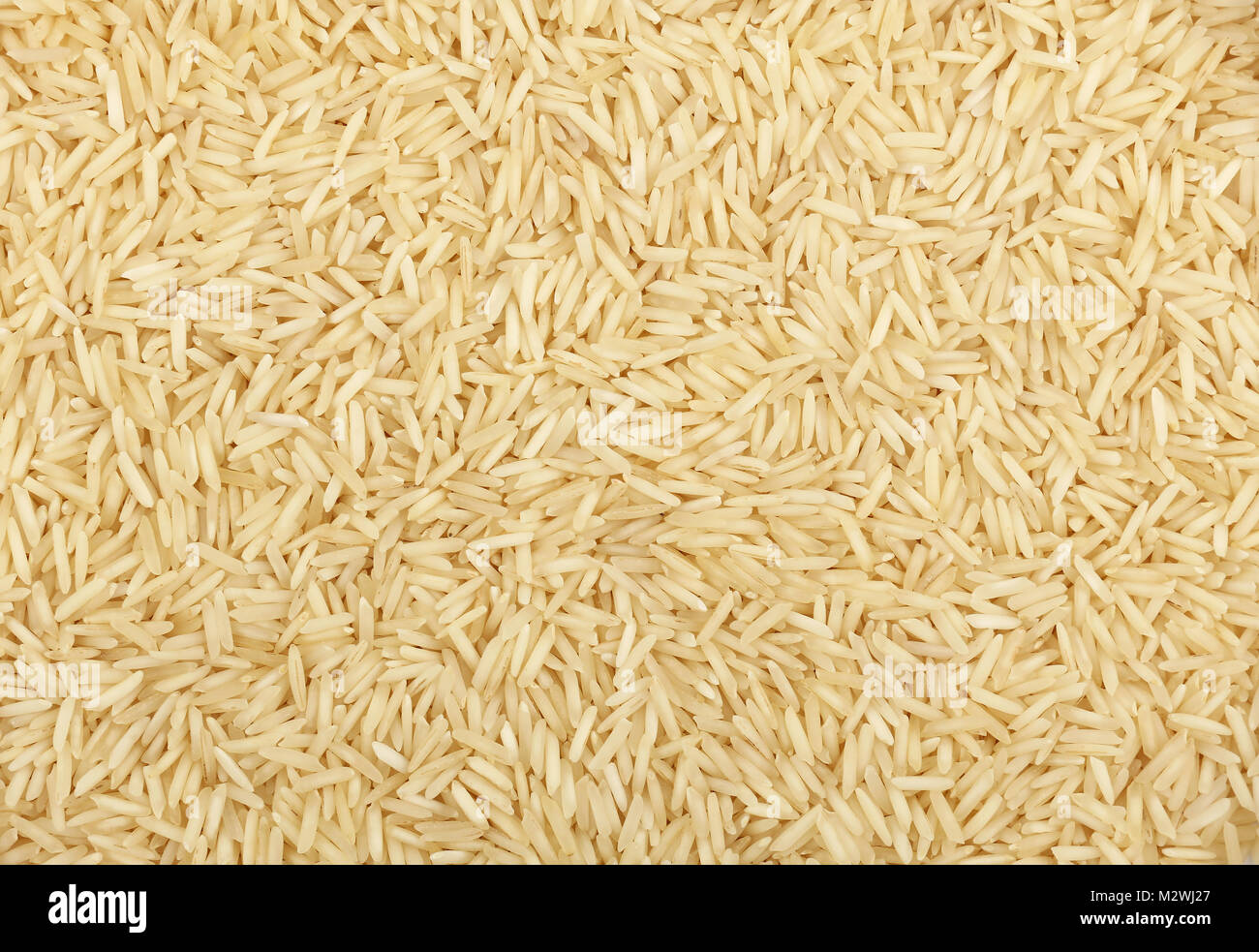 White Indian Basmati long grain rice close up pattern background ...