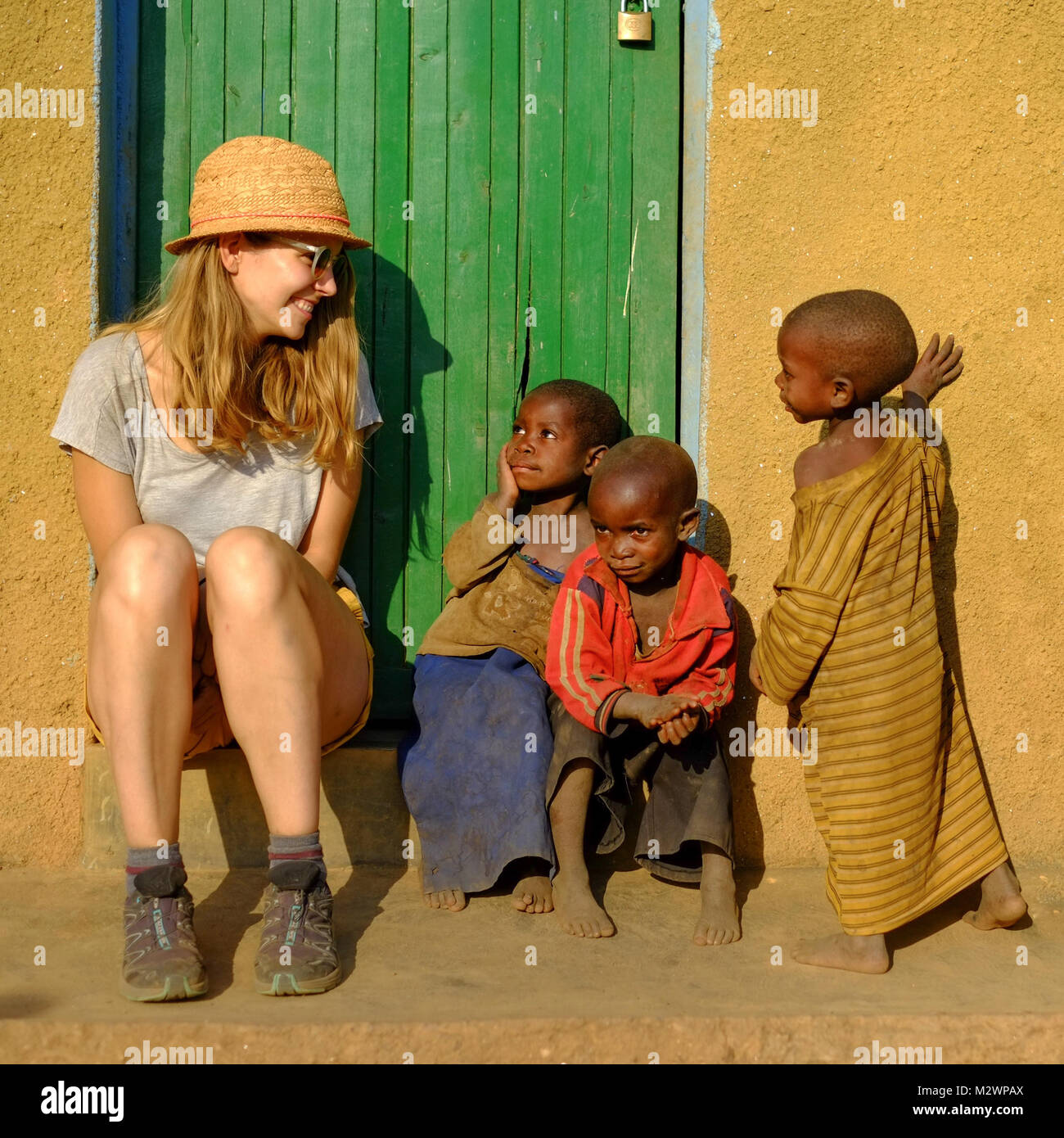 Kibuye/Rwanda - 08/25/2016: Caucasian tourist with a group of African ...