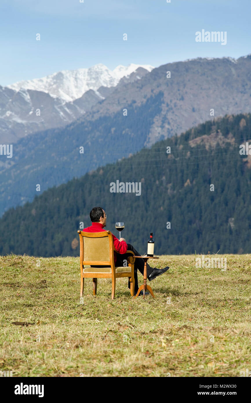 elegant man drinks wine in high altitude Stock Photo - Alamy