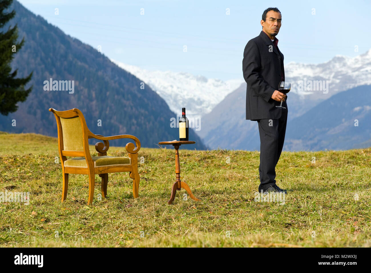 elegant man drinks wine in high altitude Stock Photo - Alamy