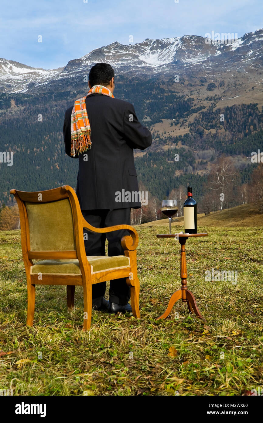 elegant man drinks wine in high altitude Stock Photo - Alamy