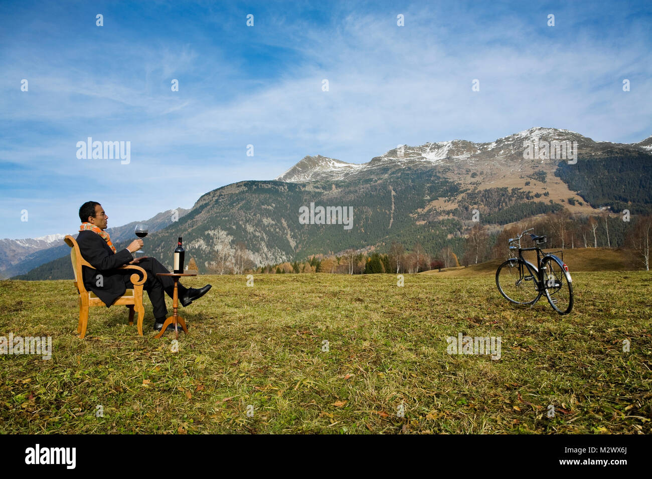 elegant man drinks wine in high altitude Stock Photo - Alamy