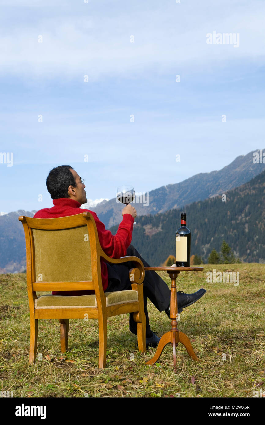 elegant man drinks wine in high altitude Stock Photo - Alamy