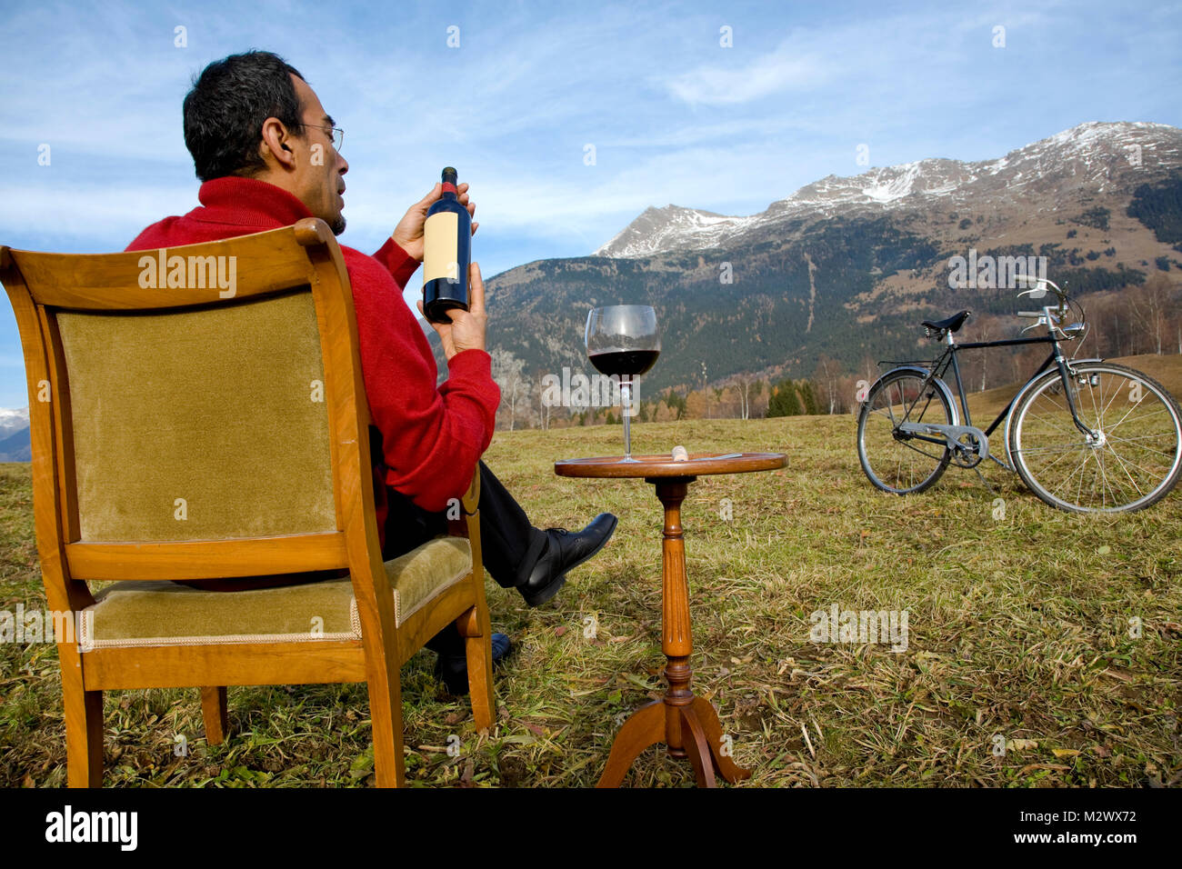 elegant man drinks wine in high altitude Stock Photo - Alamy
