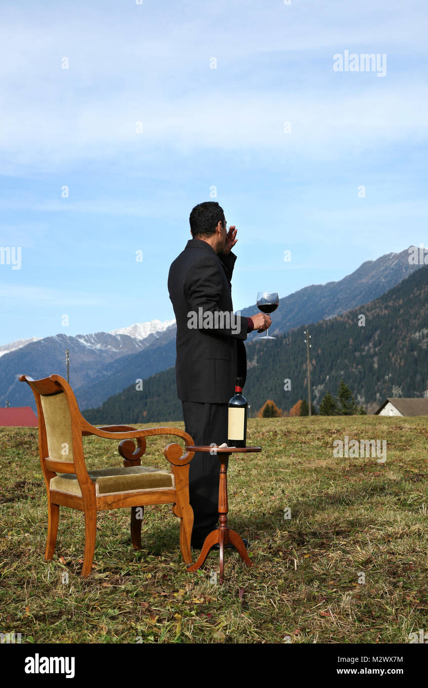 elegant man drinks wine in high altitude Stock Photo - Alamy