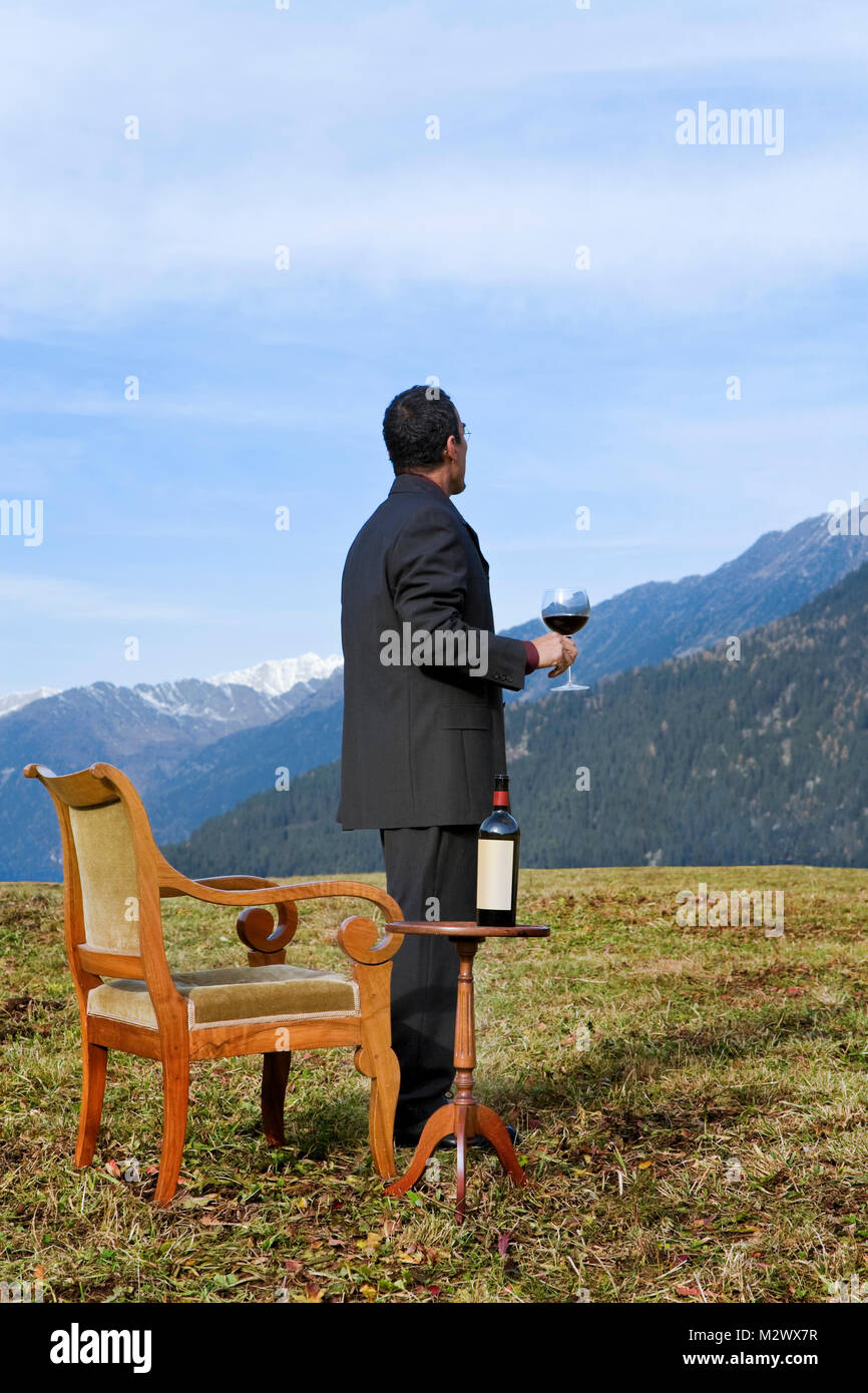 elegant man drinks wine in high altitude Stock Photo - Alamy