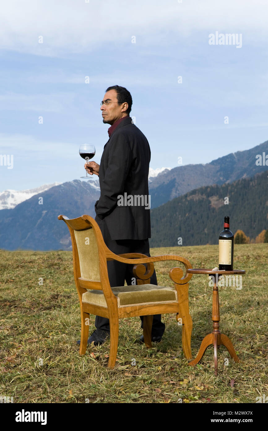 elegant man drinks wine in high altitude Stock Photo - Alamy