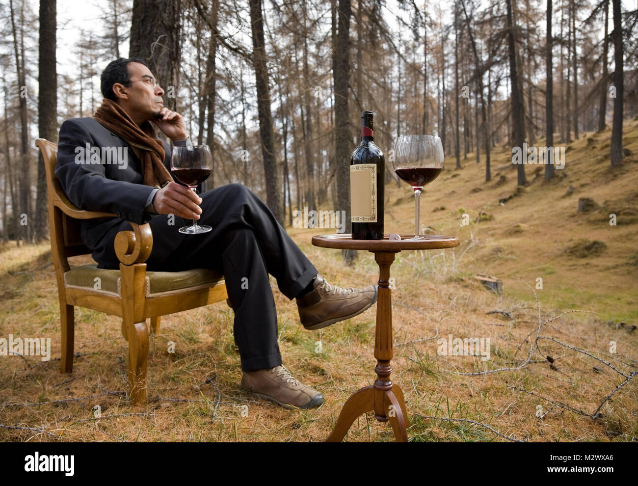 elegant man drinks wine in high altitude Stock Photo - Alamy