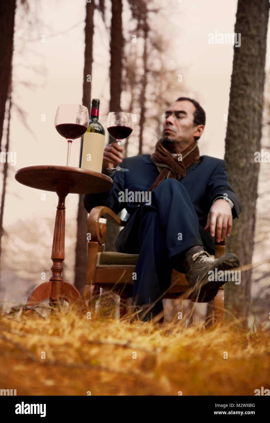 elegant man drinks wine in high altitude Stock Photo - Alamy