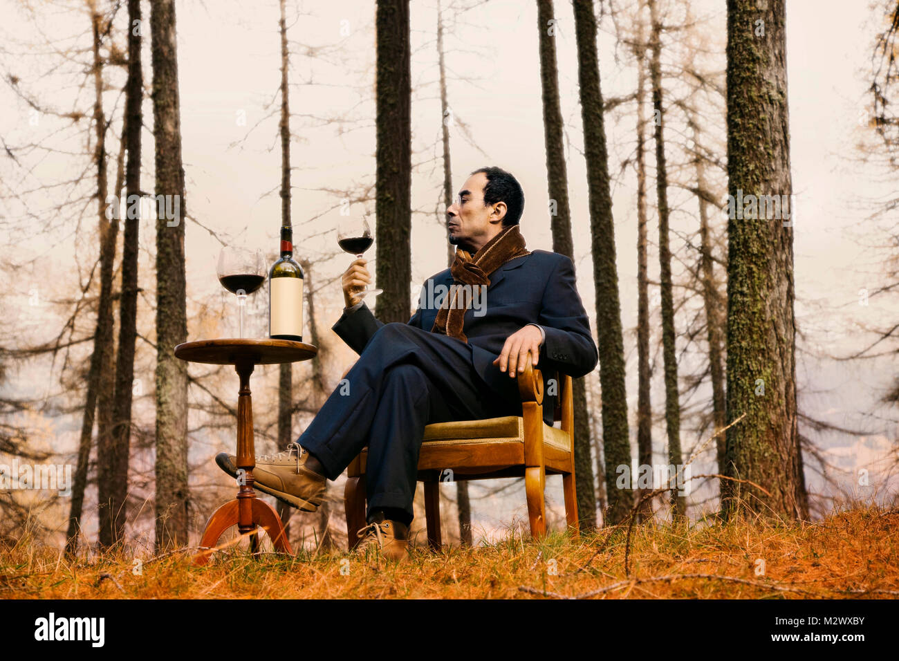 elegant man drinks wine in high altitude Stock Photo - Alamy