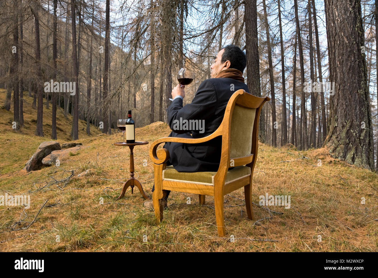 elegant man drinks wine in high altitude Stock Photo - Alamy