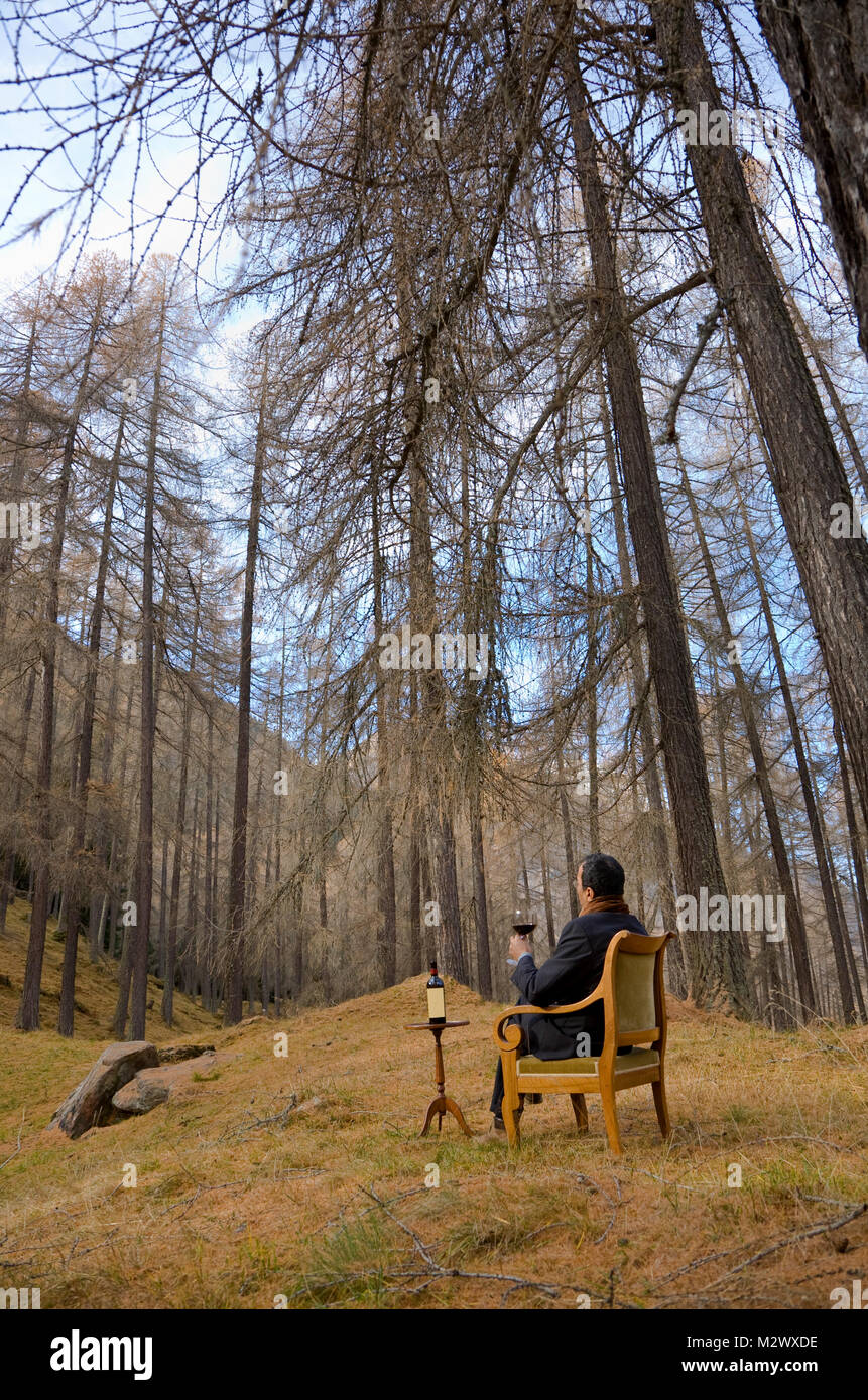 elegant man drinks wine in high altitude Stock Photo - Alamy