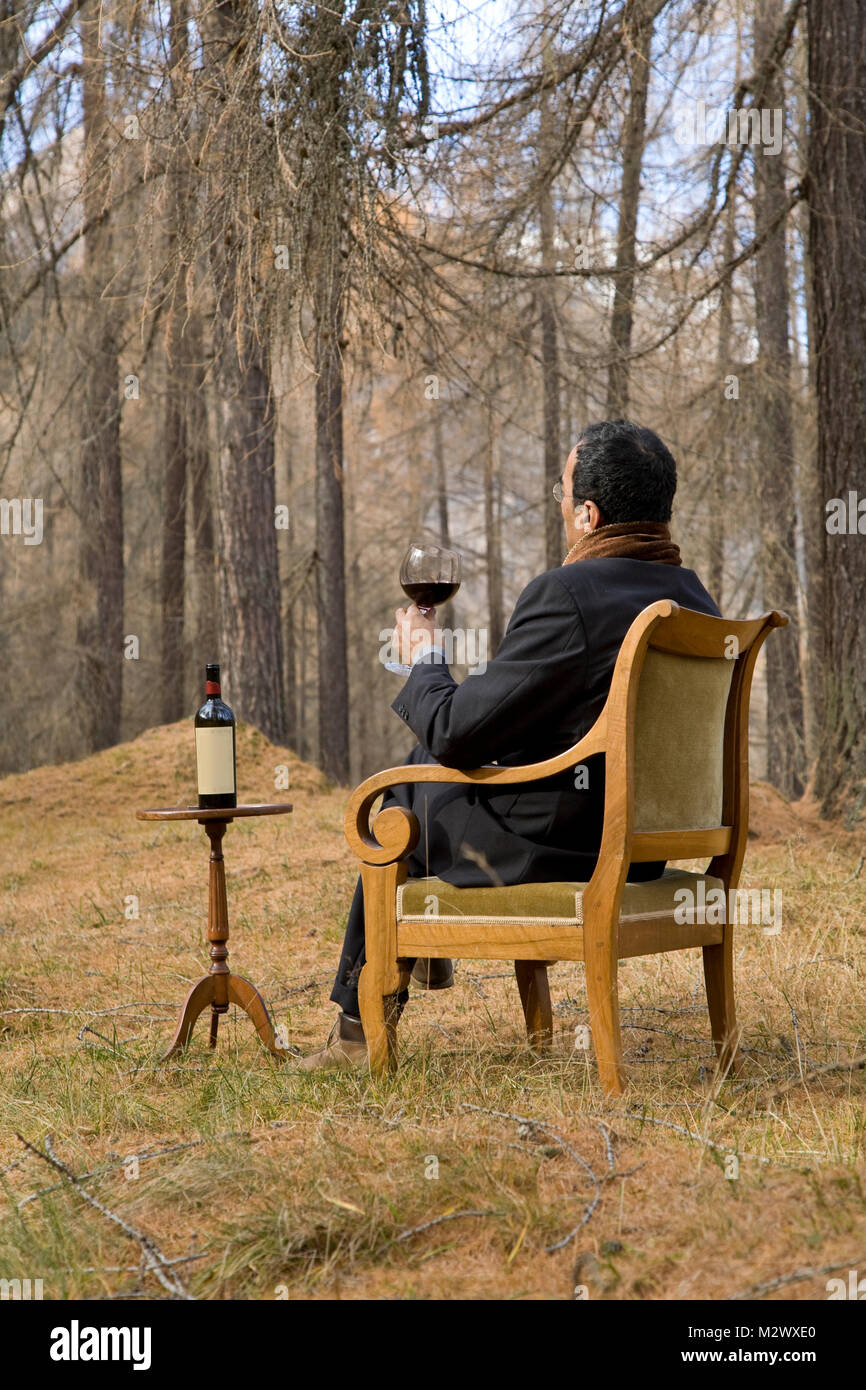 elegant man drinks wine in high altitude Stock Photo - Alamy