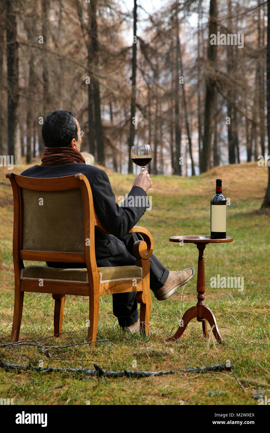 elegant man drinks wine in high altitude Stock Photo - Alamy