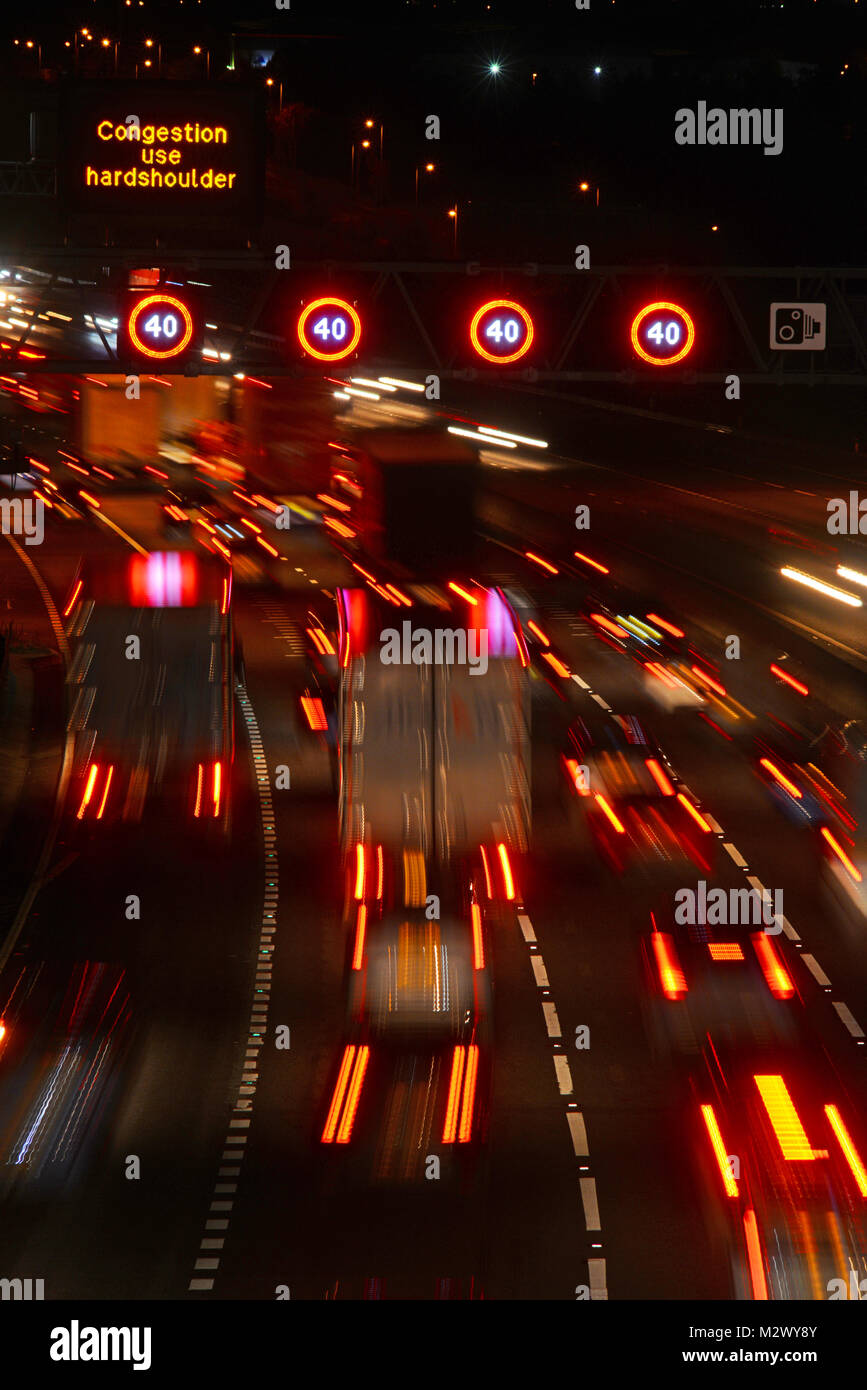 traffic jam by reduced speed limit and speed camera warning signs and ...