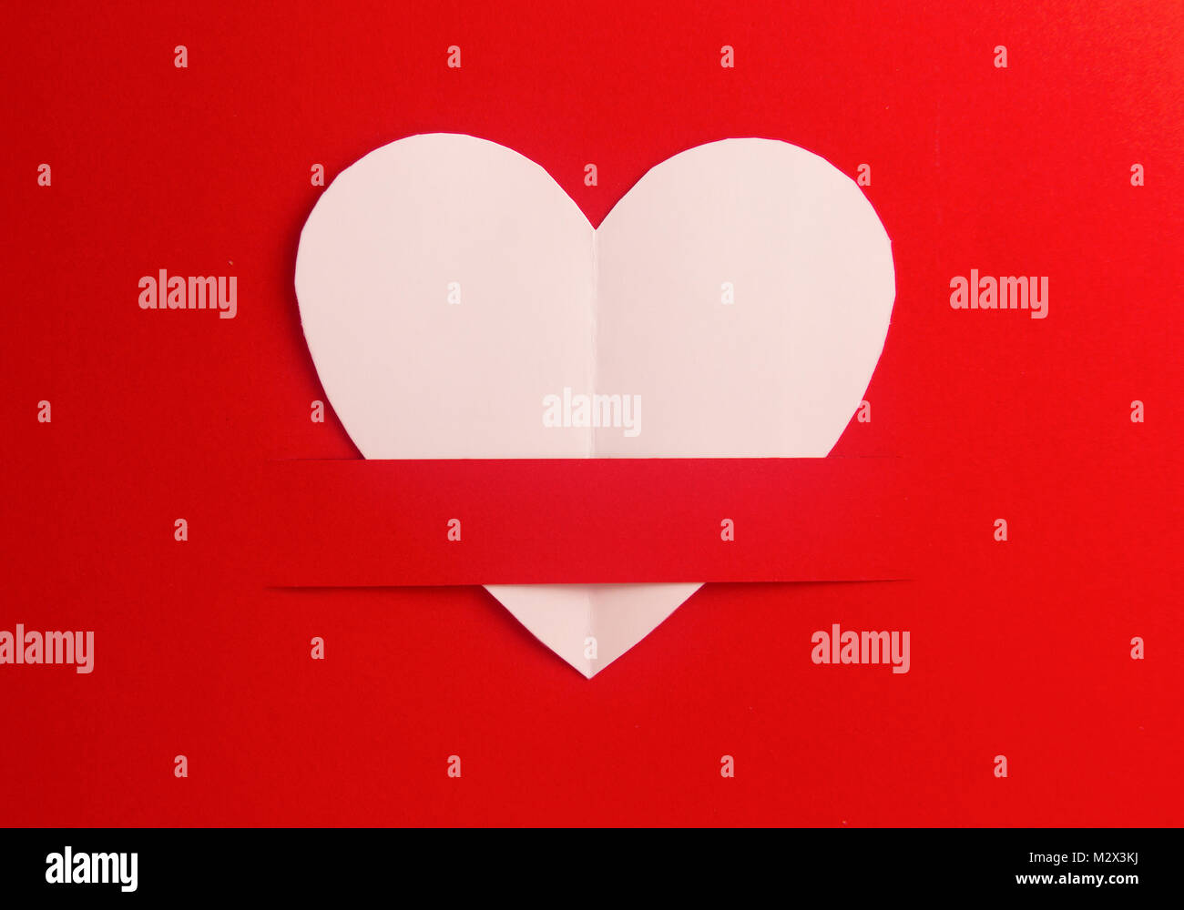 Heart shaped white paper in red background, Heart cut from white paper ...
