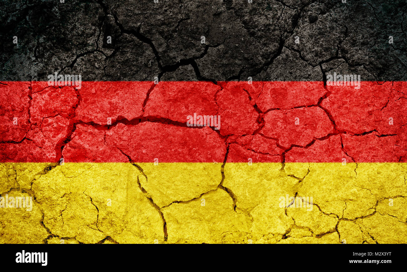 Federal Republic of Germany flag on dry earth ground texture background ...