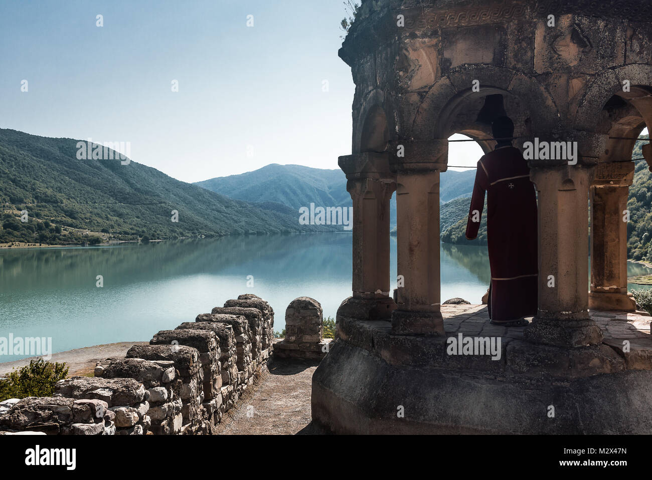 Young priest playng bell in a orthodox monastery Georgia Stock Photo ...