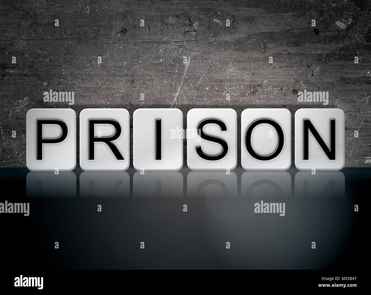 The word Prison concept and theme written in white tiles on a dark ...