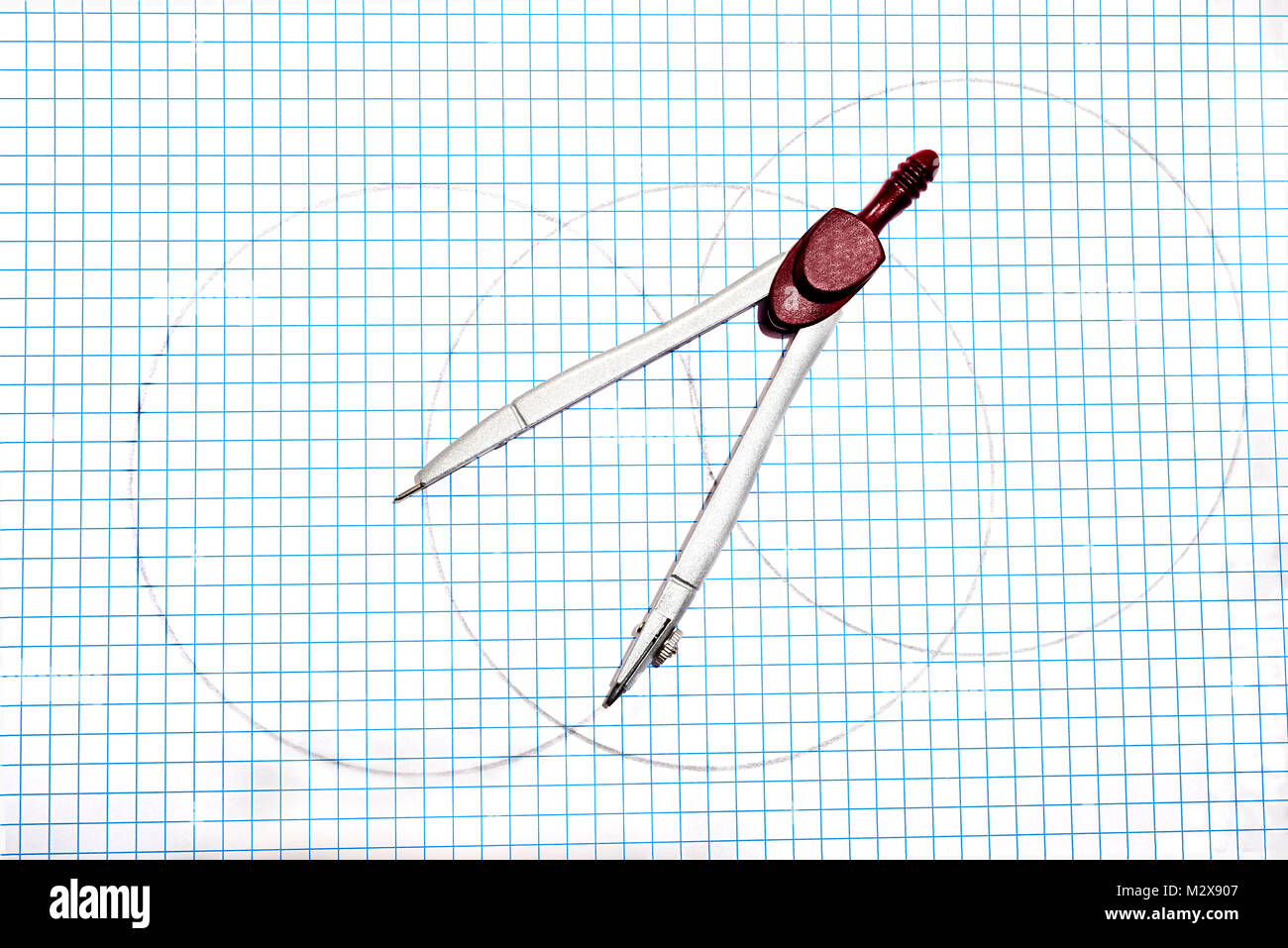 compass on white graph paper Stock Photo - Alamy