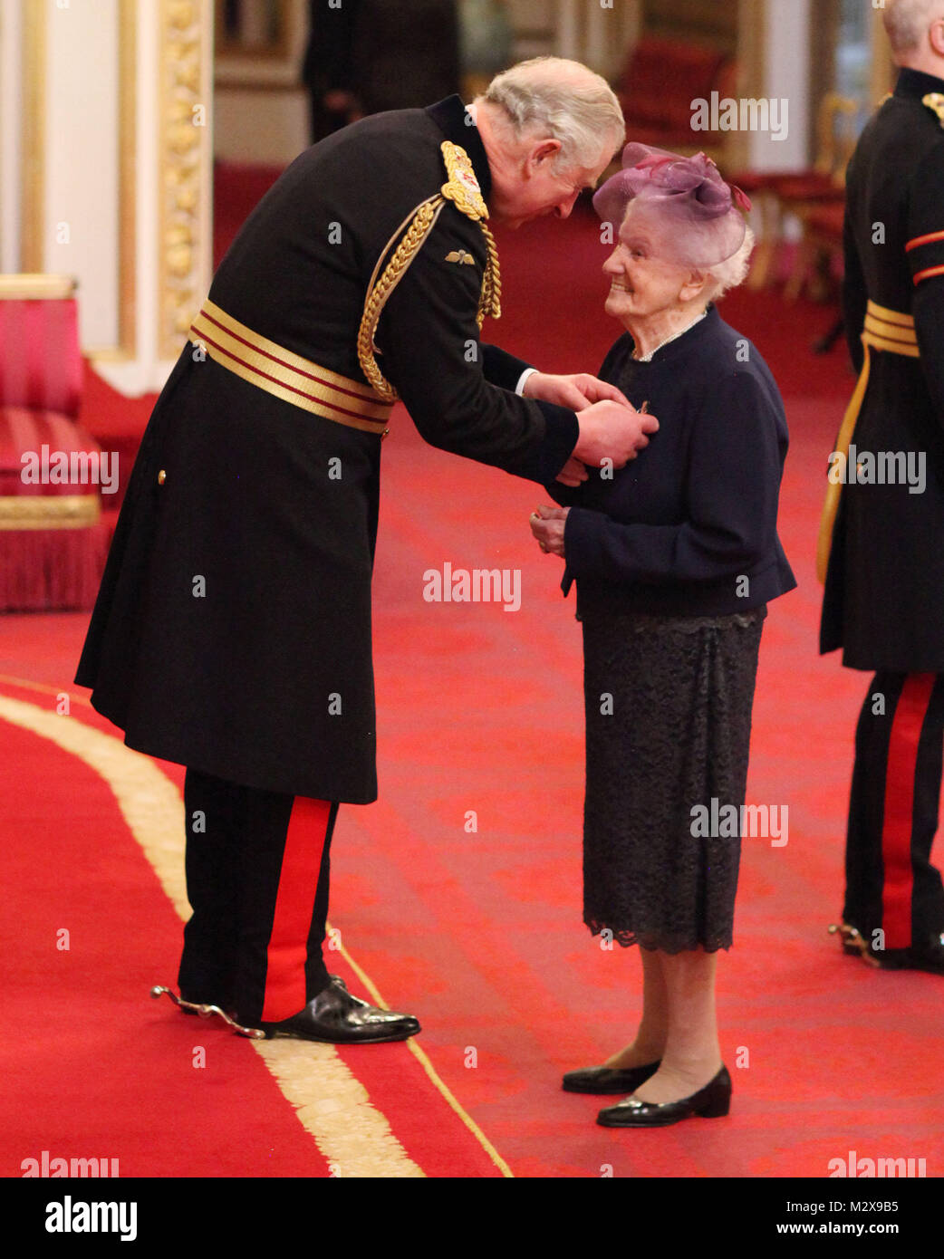 Made mbe by prince wales investiture ceremony buckingham palace hi-res ...