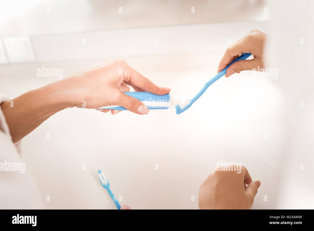 Toothpaste put on toothbrush hi-res stock photography and images - Alamy
