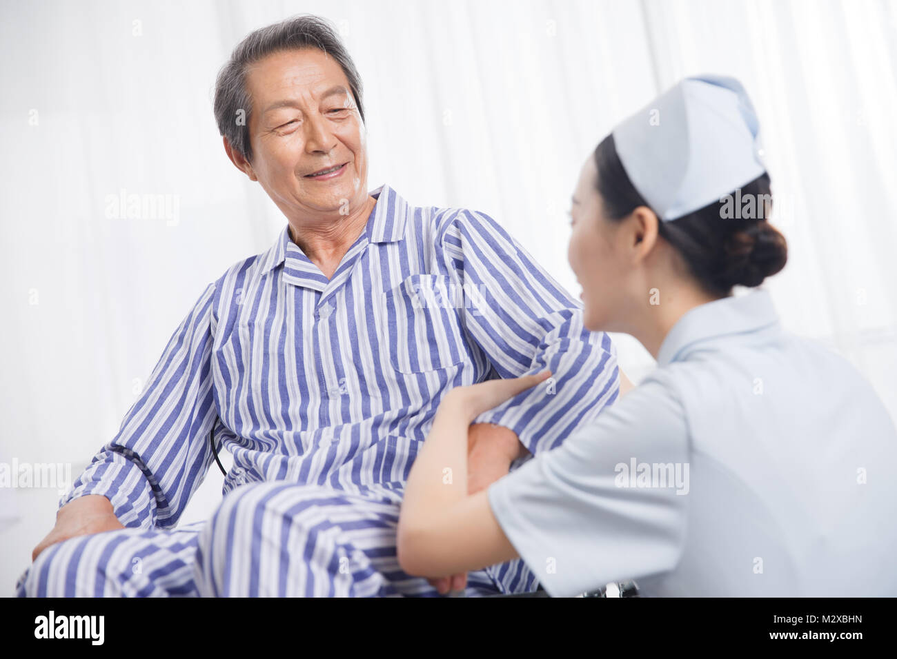 Patients and nurses Stock Photo - Alamy