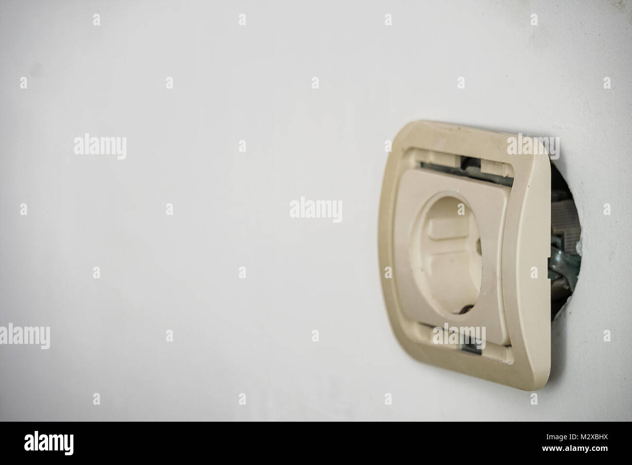 Old European electrical socket outlet falling out of wall and in need ...